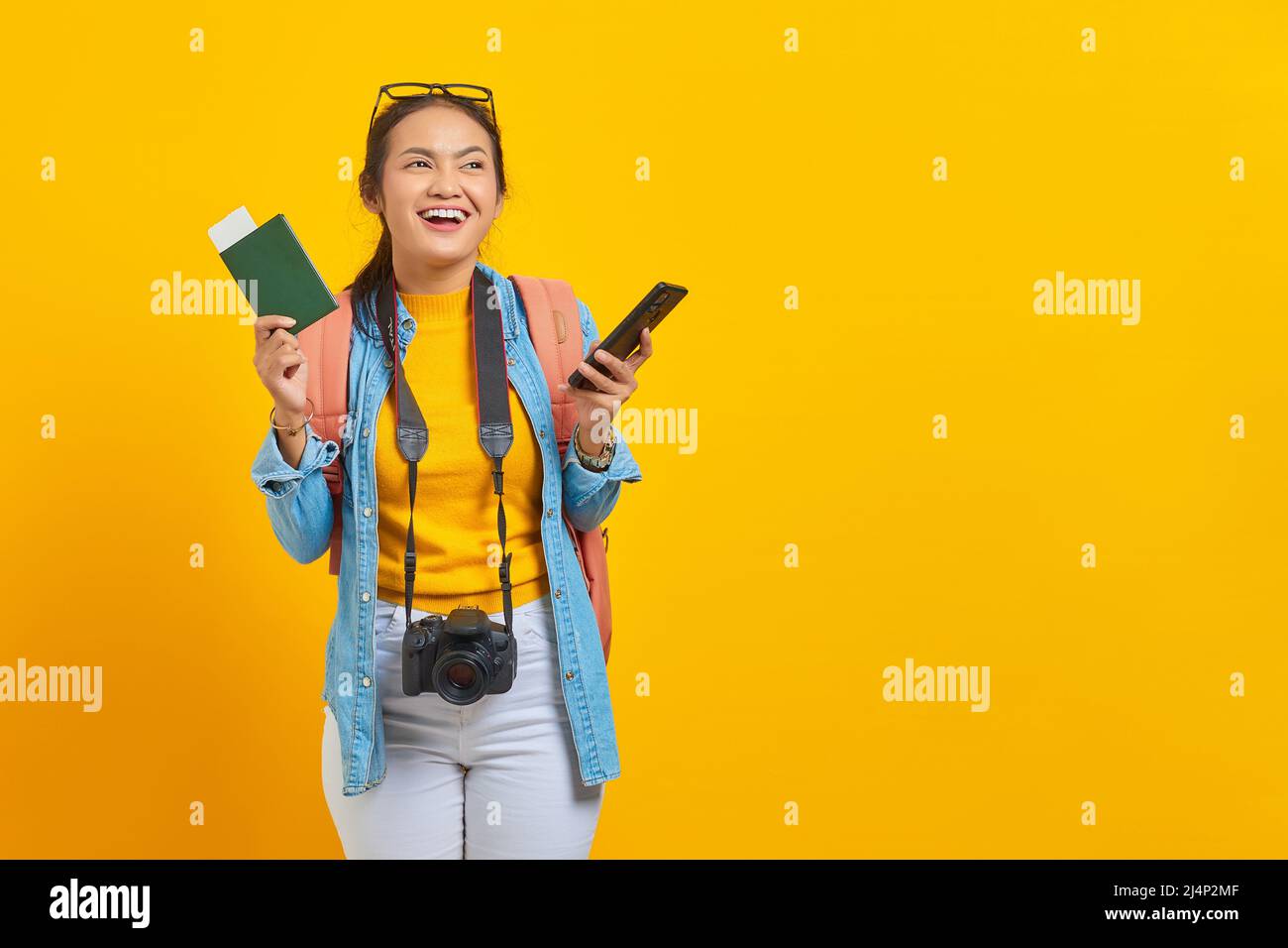 Portrait Of Cheerful Young Asian Traveler Holding Passport Boarding