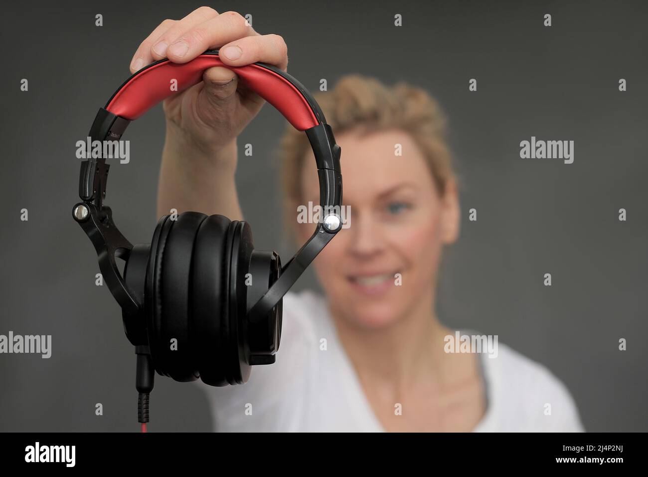 headphones listening to music with grey background with people stock ...