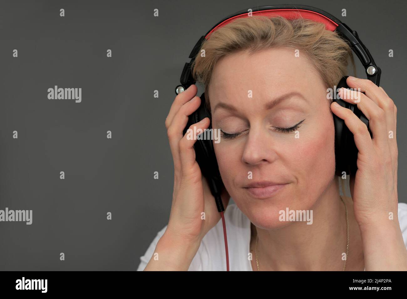 headphones listening to music with grey background with people stock ...