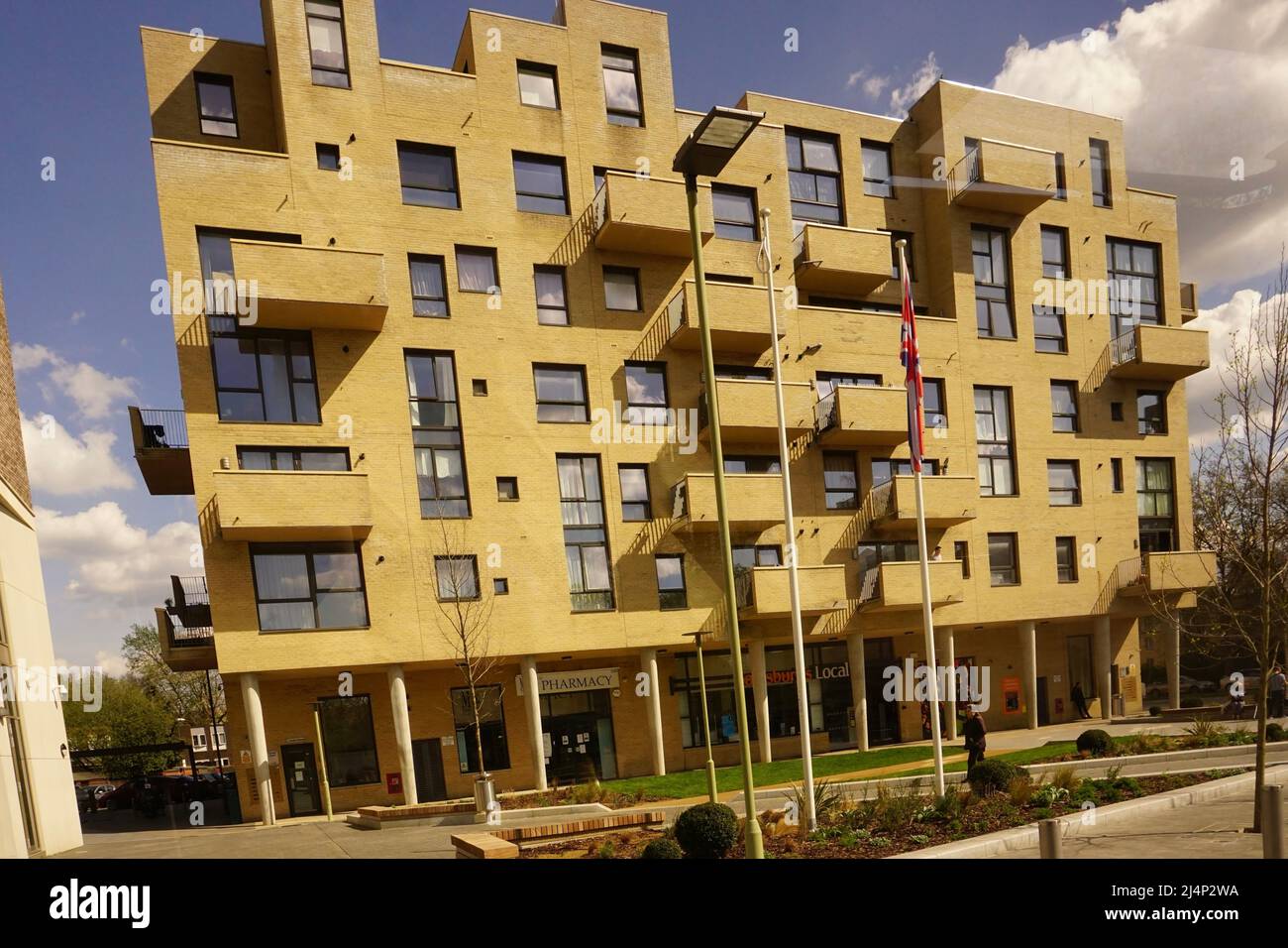 Beautiful brown high rise block of flats above Sainsburys Local and The ...