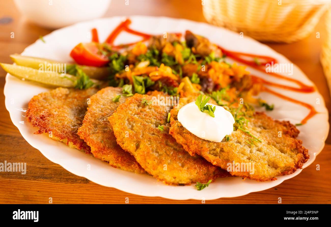 belarusian draniki with grilled beef dish in a restaurant Stock Photo ...