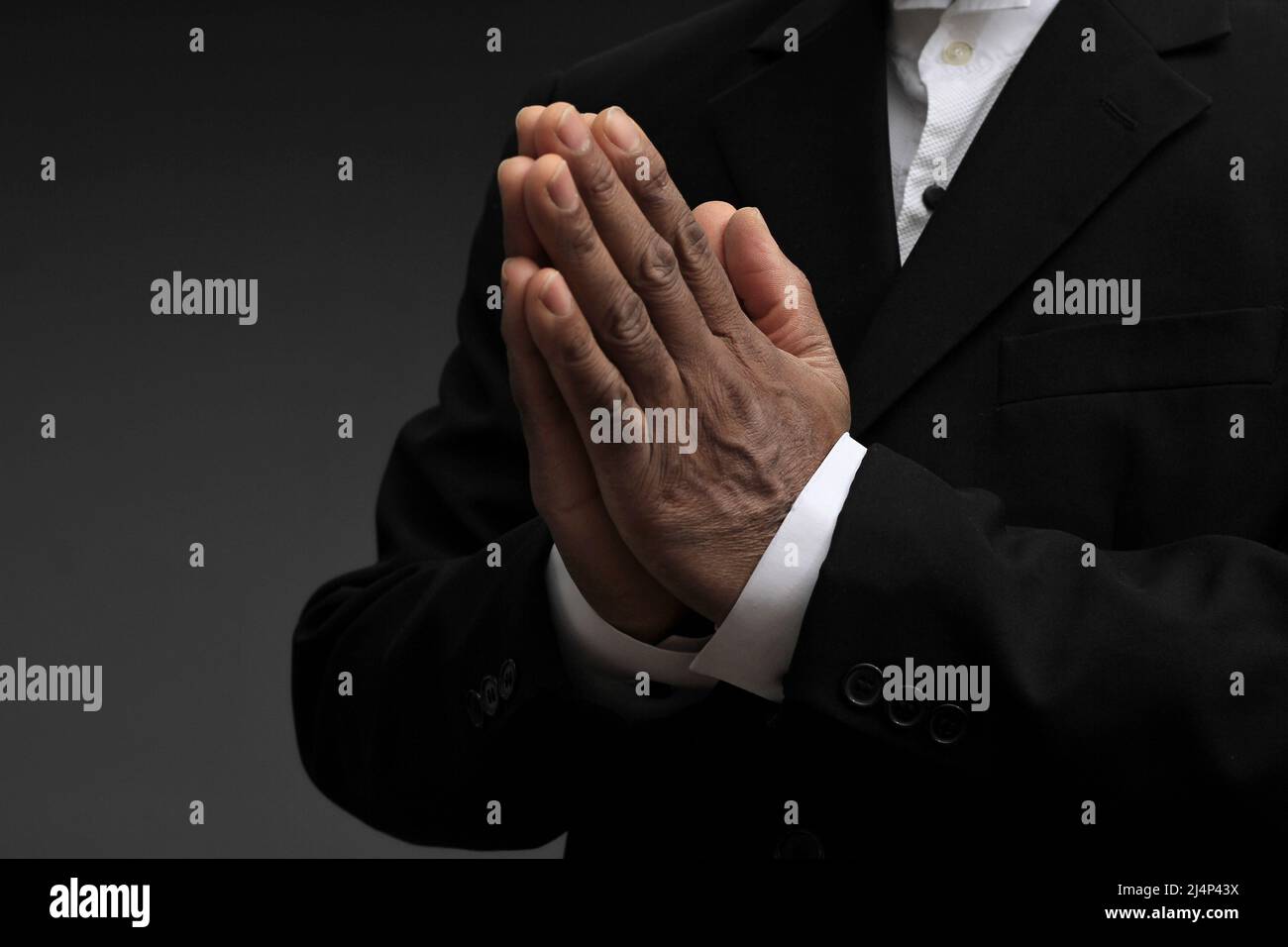 hands together praying to God stock photo Stock Photo - Alamy