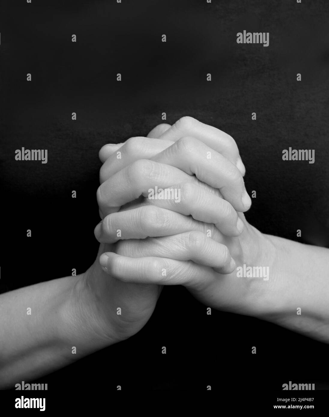 Hand hands religion cross christian Black and White Stock Photos ...