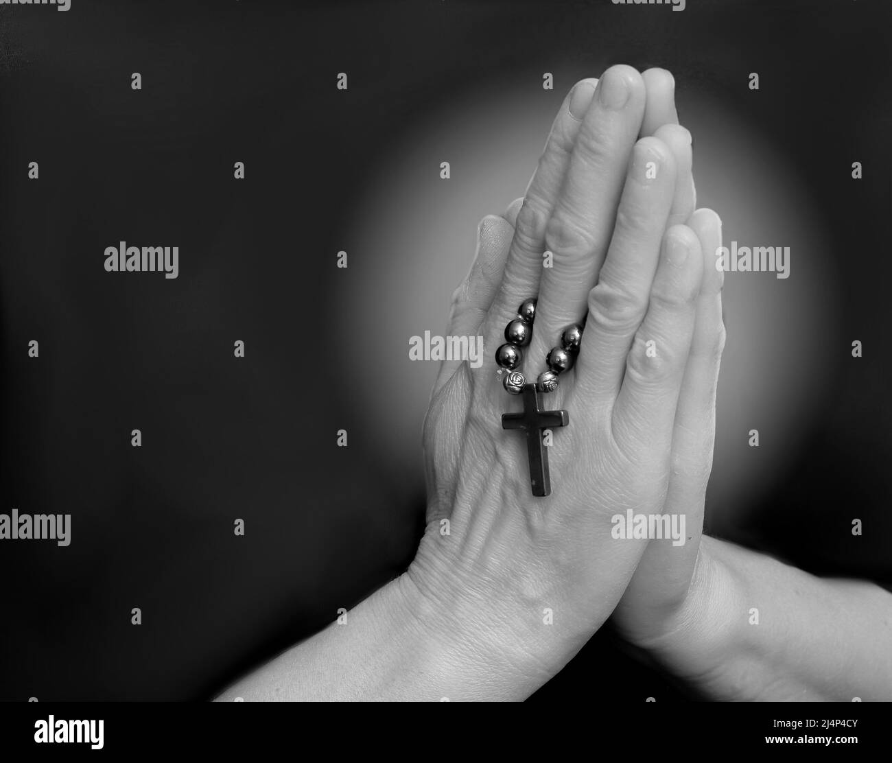 hands together praying to God stock photo Stock Photo - Alamy