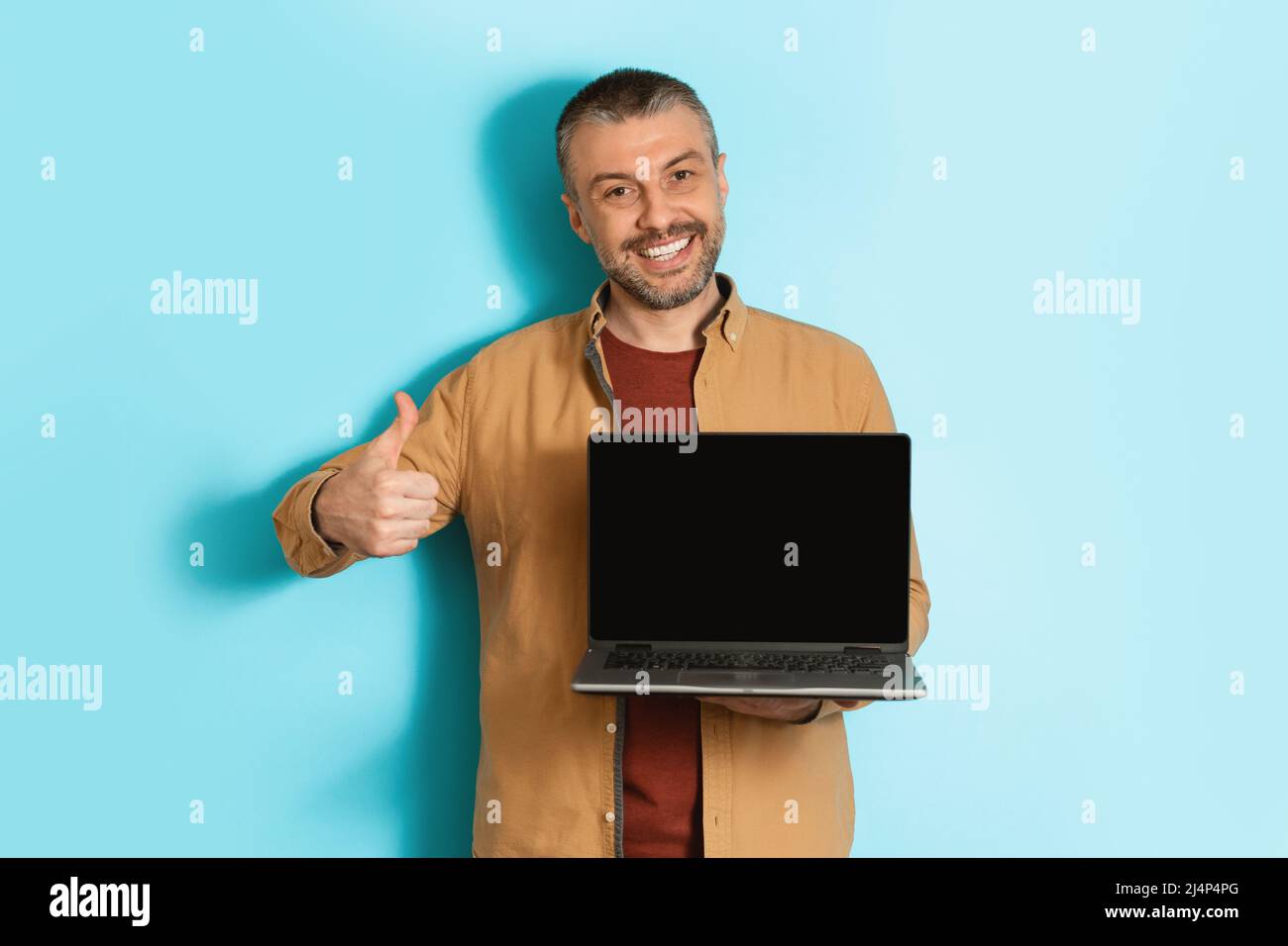 Businessman laptop happy thumbs up High Resolution Stock Photography ...