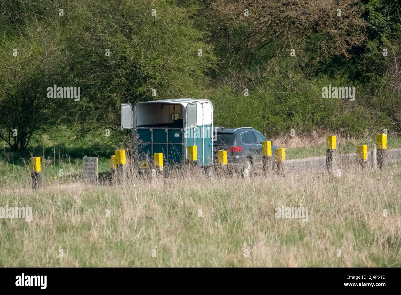 large dark red coach work horse transport lorry in motion through open ...