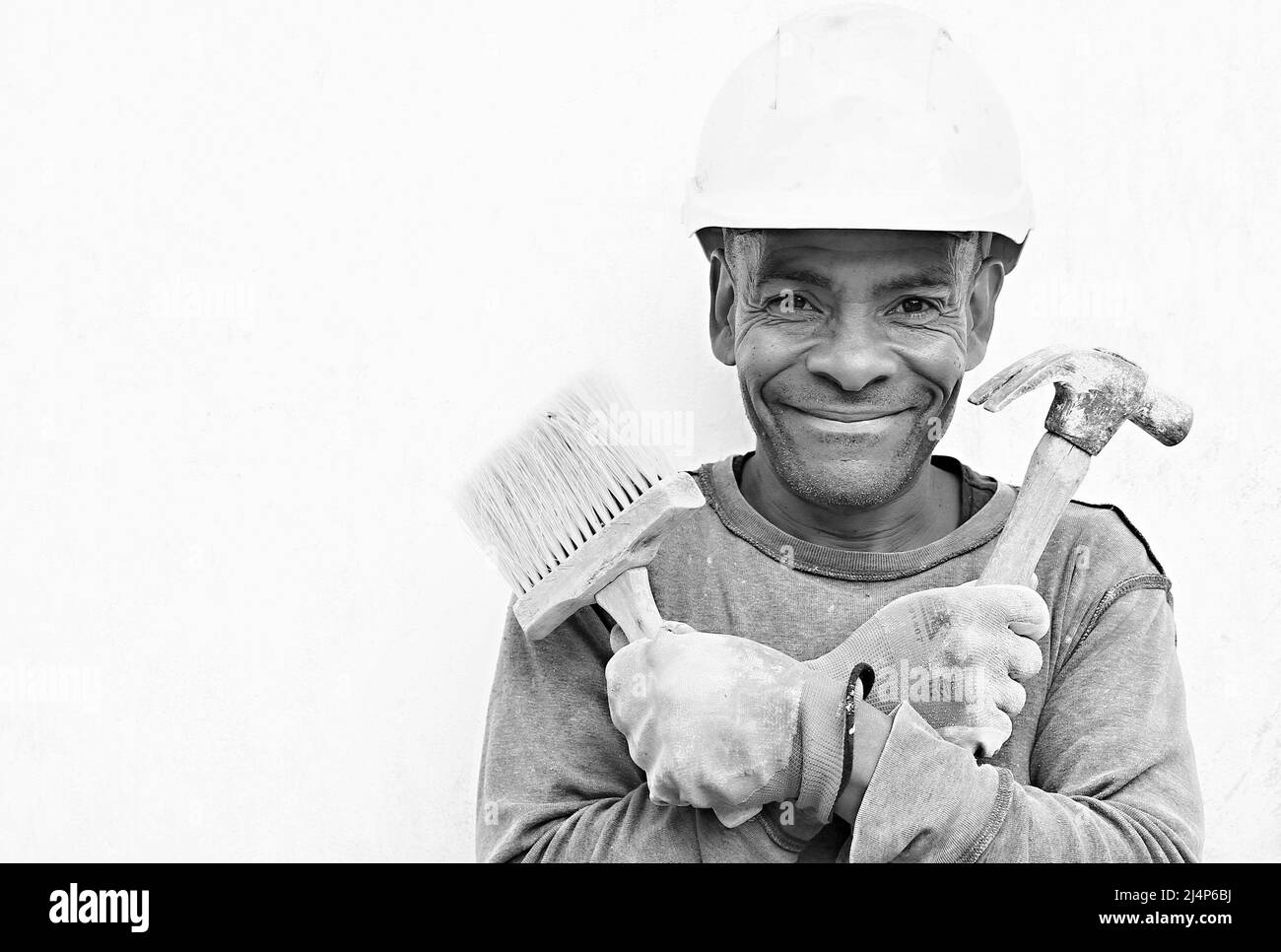 professional builder holding his tools on white background with people ...