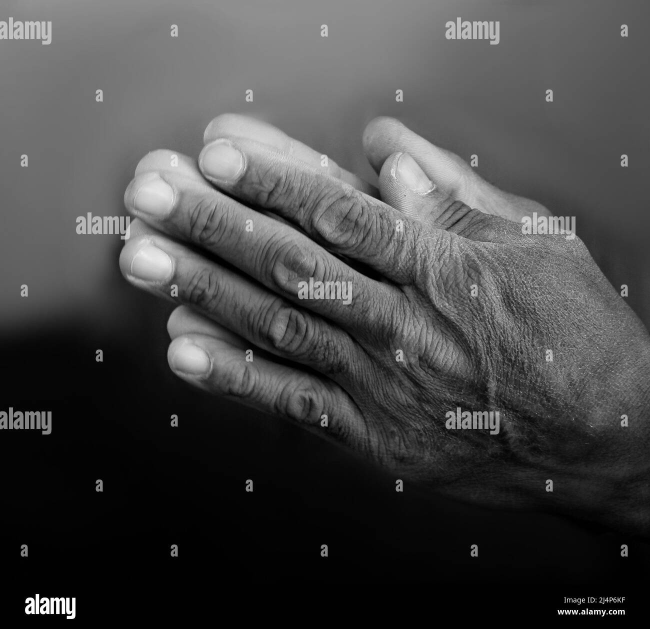 hands together praying to God stock photo Stock Photo - Alamy