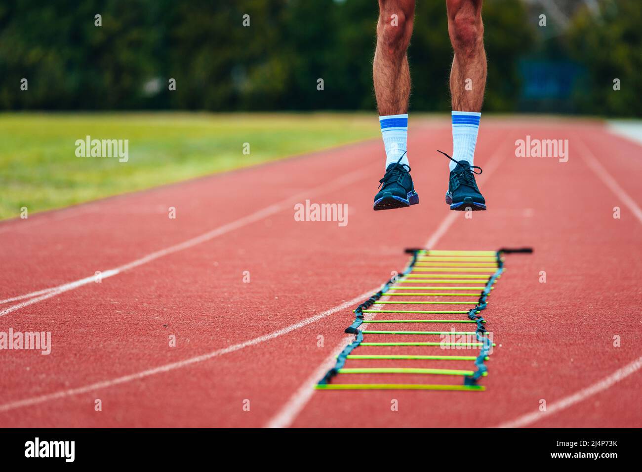 Legs of a man, a runner in the air jumping. Morning workout ...