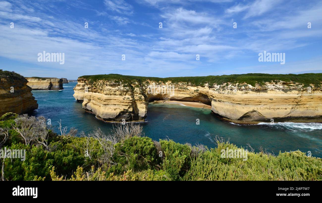 High eroded sandstone cliffs and secret cove beaches on the Great Ocean ...