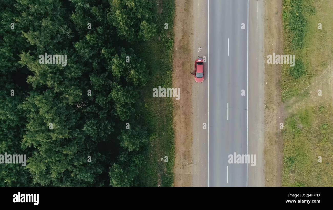 Top view of dividing line of forests and fields. Scene. Cars are ...