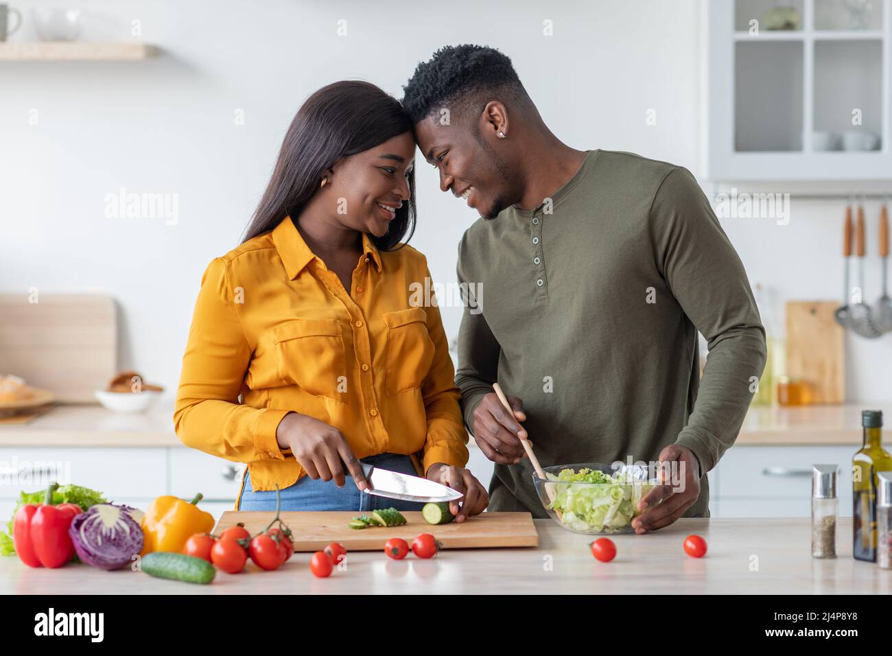 Happy African American Spouses Bonding In Kitchen While Preparing ...