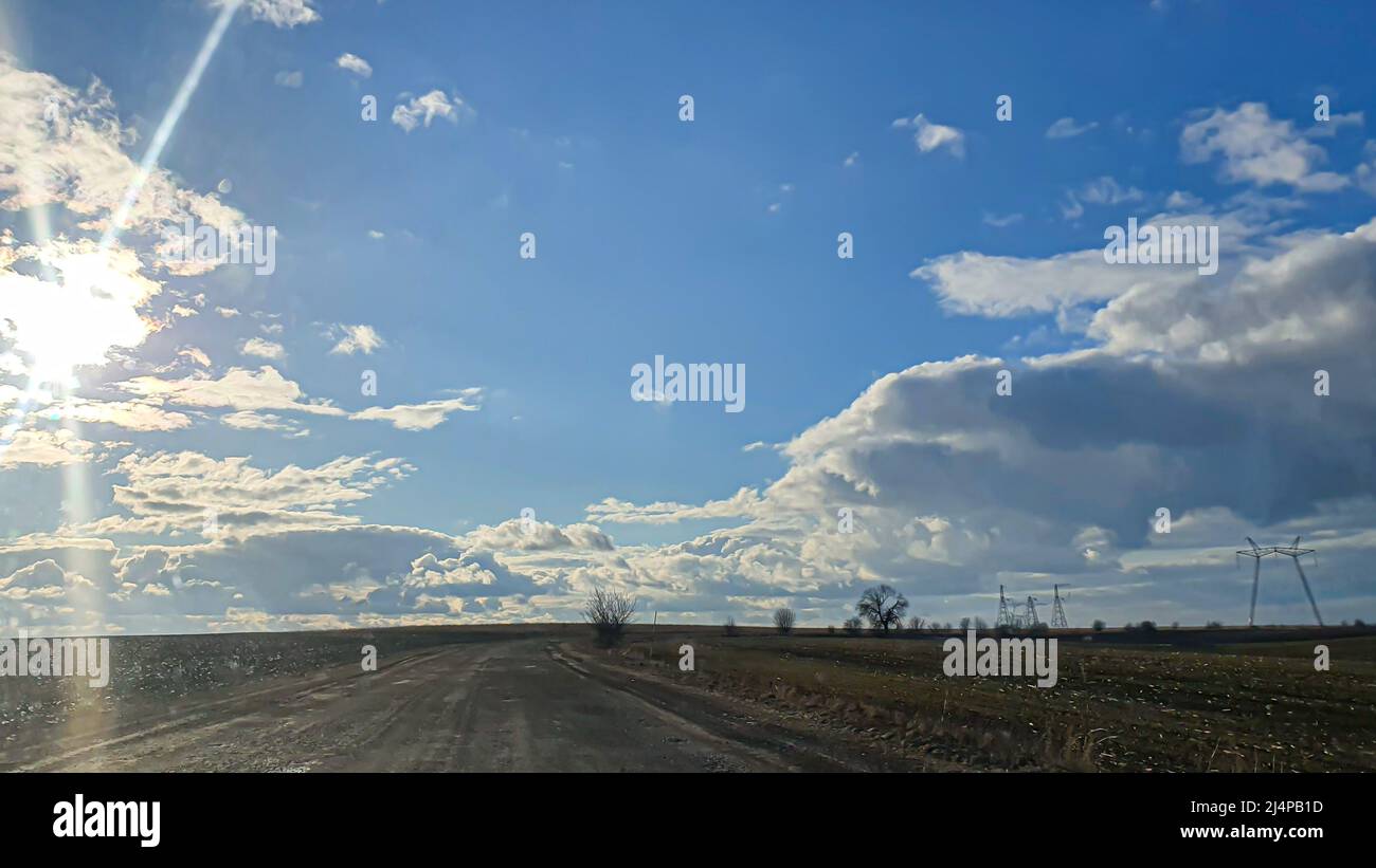 Blue sky with clouds. Road, exit from the occupied territories. War in ...