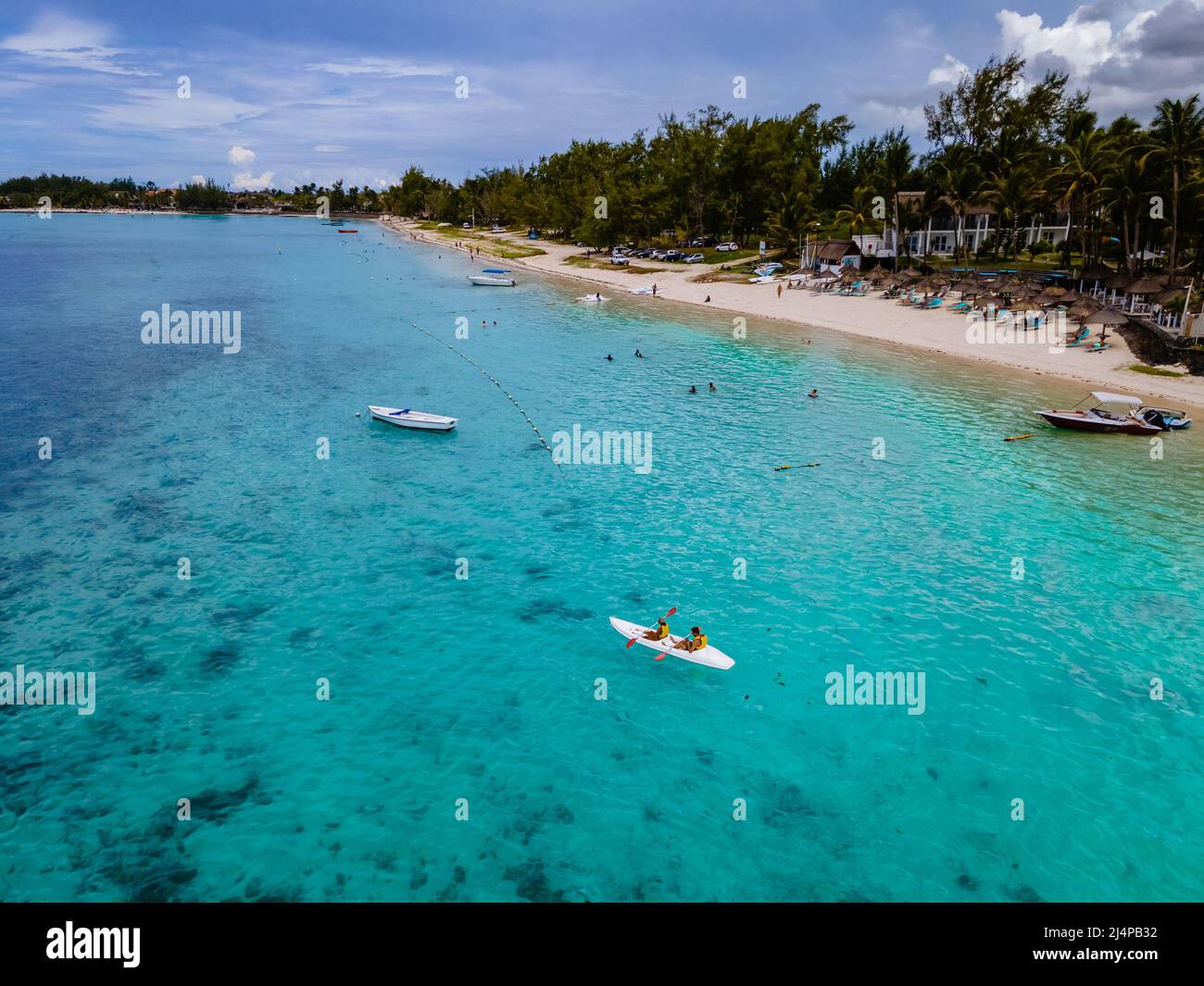 Mauritius vacation, couple man and woman in a kayak in a bleu ocean in ...