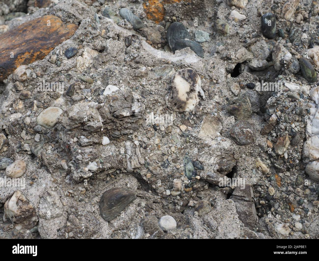 rocks set in concrete useful as a background Stock Photo - Alamy