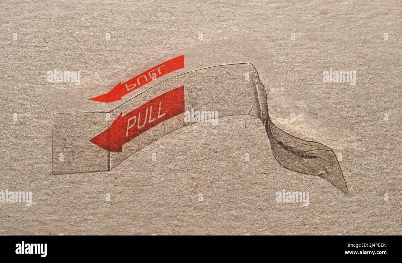 pull label with red arrow indicating direction Stock Photo - Alamy
