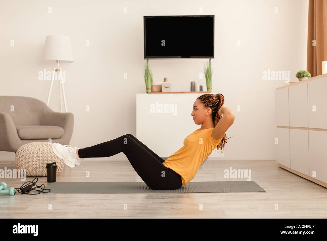 Lady doing abs crunches exercise hi-res stock photography and images ...