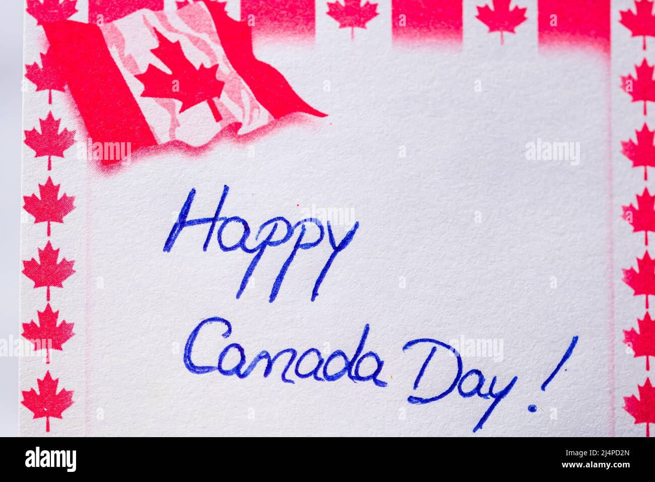 Happy Canada day handwriting on paper with Canada flag. Writing text on ...