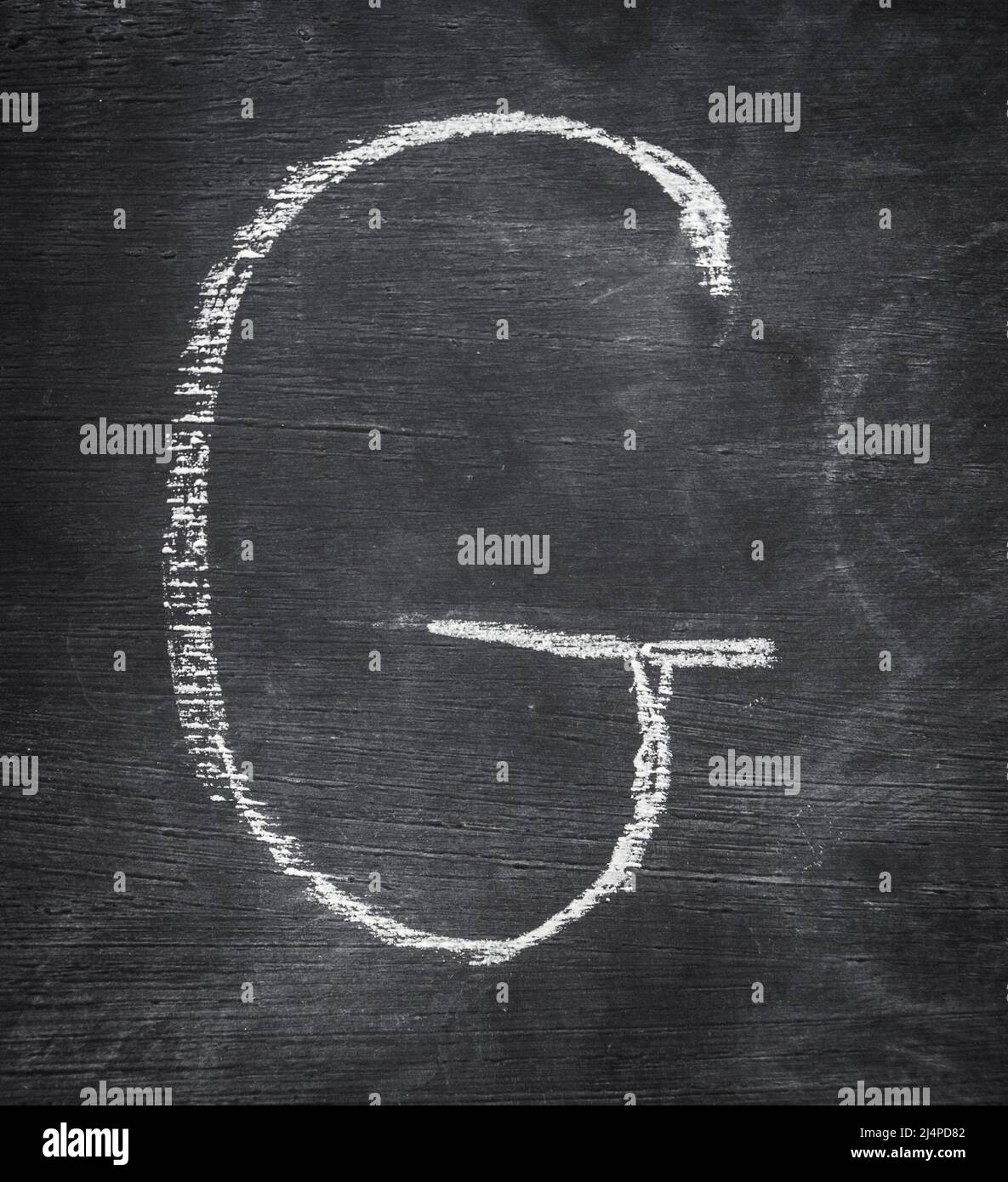 G - letter written on black chalkboard Stock Photo - Alamy