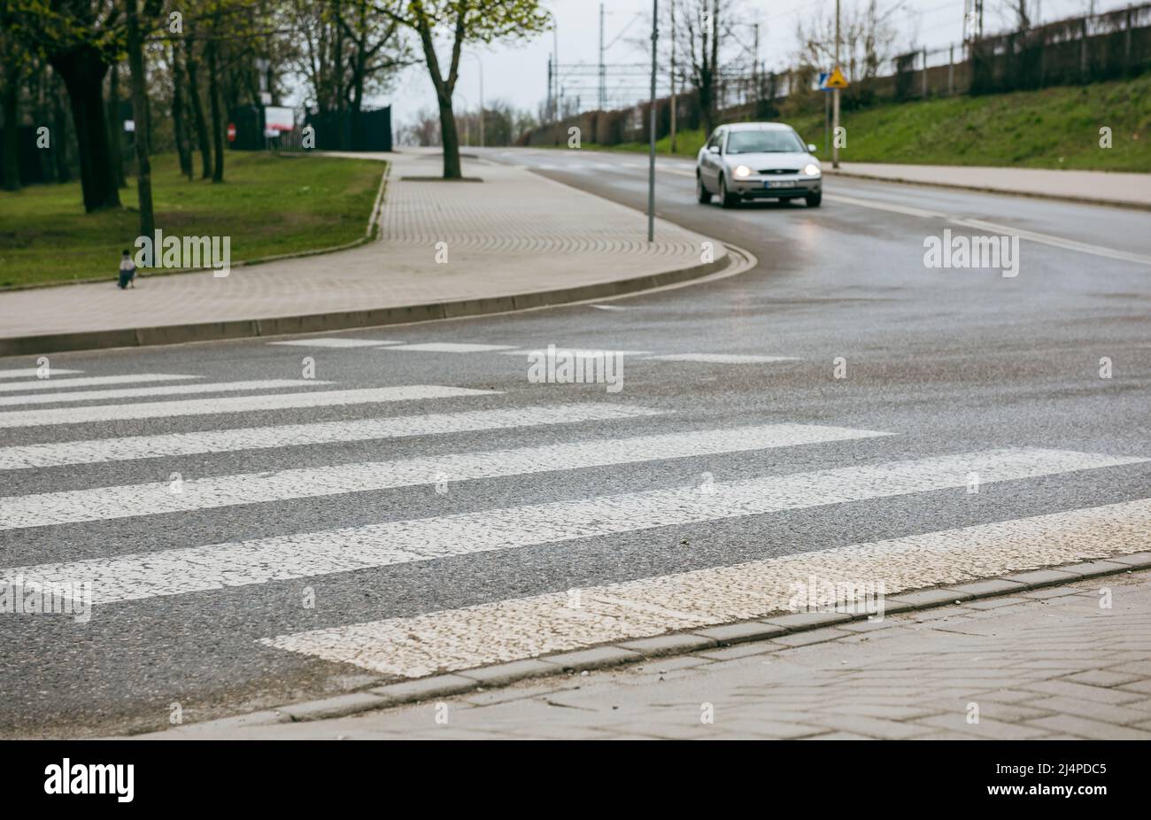 Pedestrian crossing at the intersection of three roads Stock Photo - Alamy