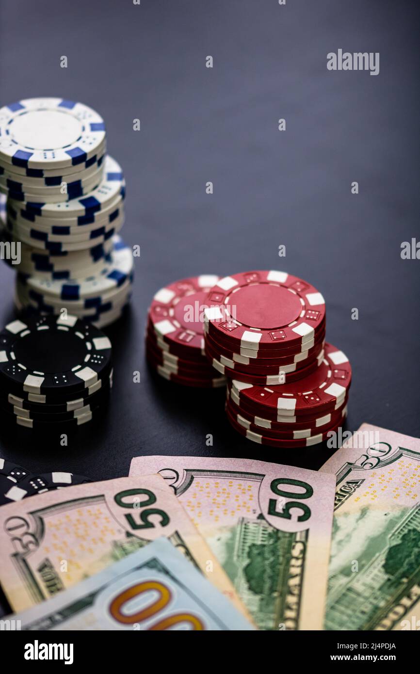 Stacks of poker chips with money and cards Stock Photo - Alamy
