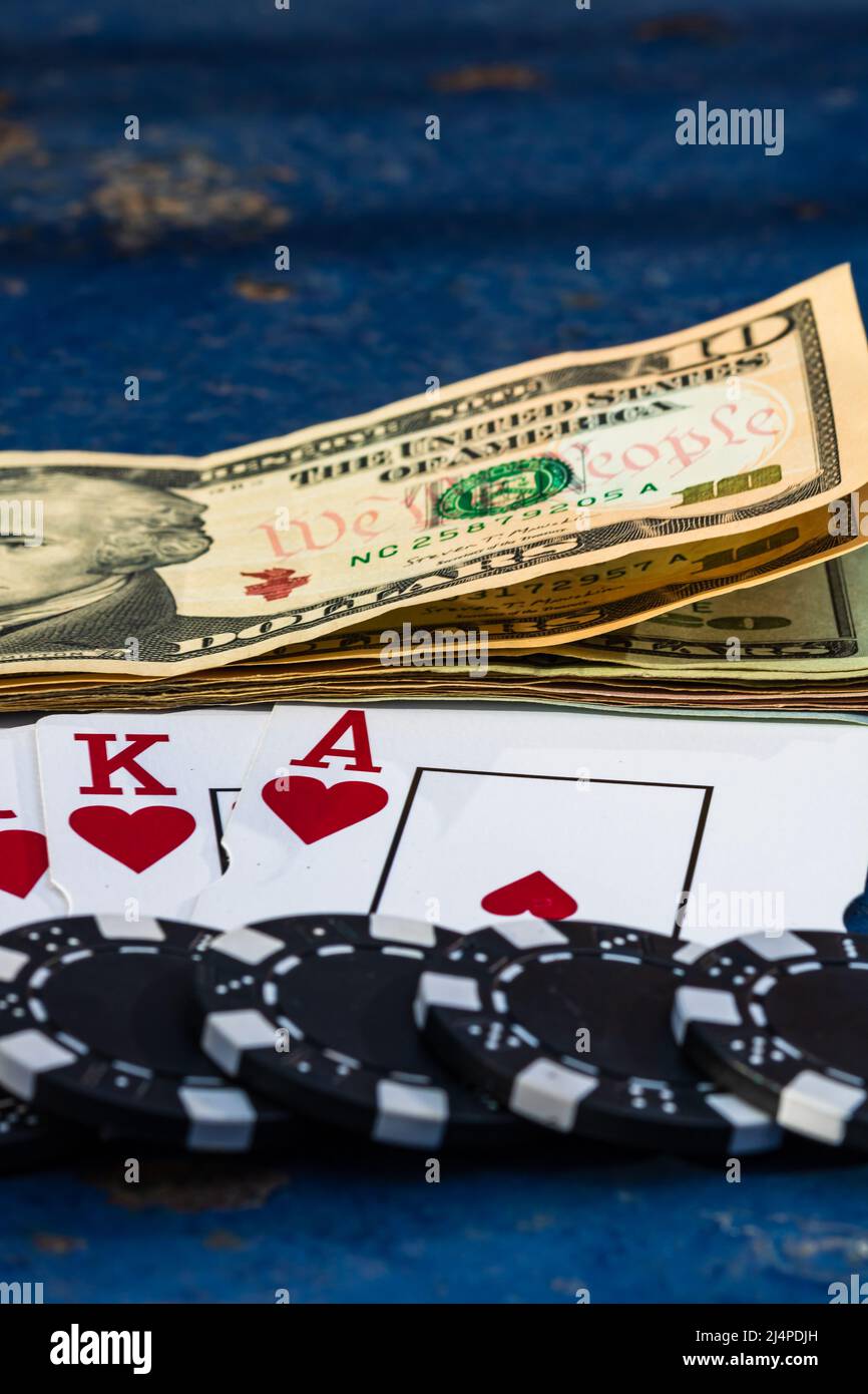 Stacks of poker chips with money and cards Stock Photo - Alamy