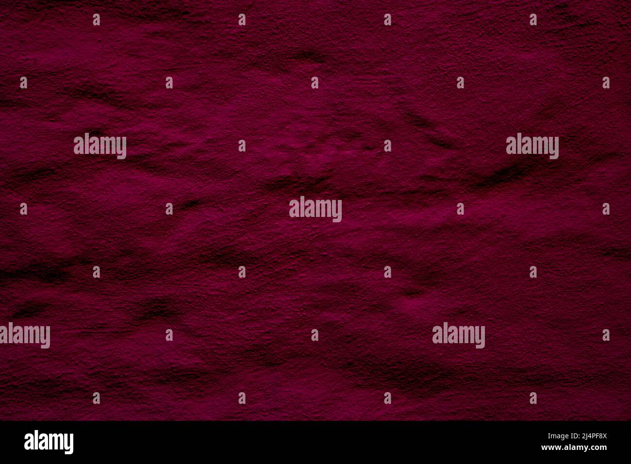 Crimson colored wall background with textures of different shades of ...
