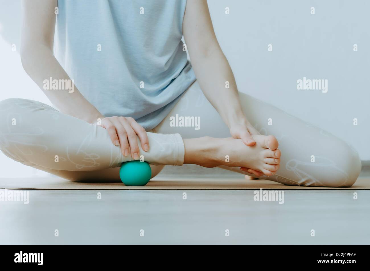 Close up of person doing myofascial release on outer shin muscles ...