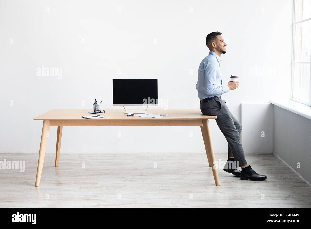 Arab Worker Showing Laptop With Black Empty Screen, Mockup Stock Photo ...