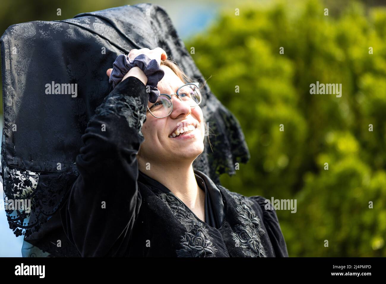 Burg, Germany. 17th Apr, 2022. A woman in black traditional costume ...