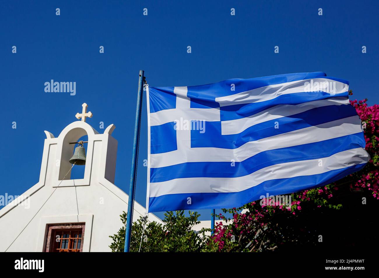Greek flag waving against the blue sky and Greek architecture Stock ...