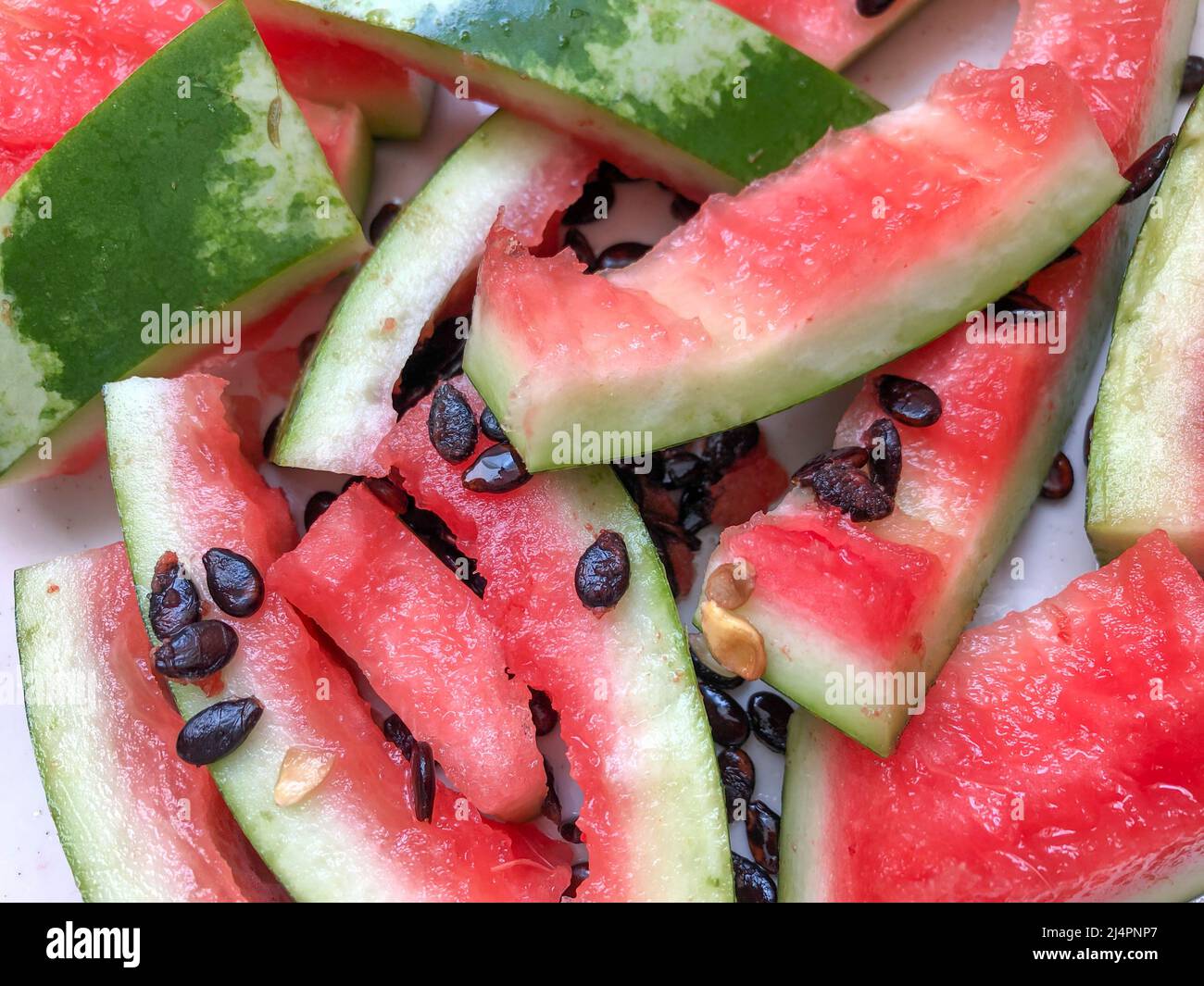 watermelon rinds, closeup top view rind and seed leftovers from cut or ...