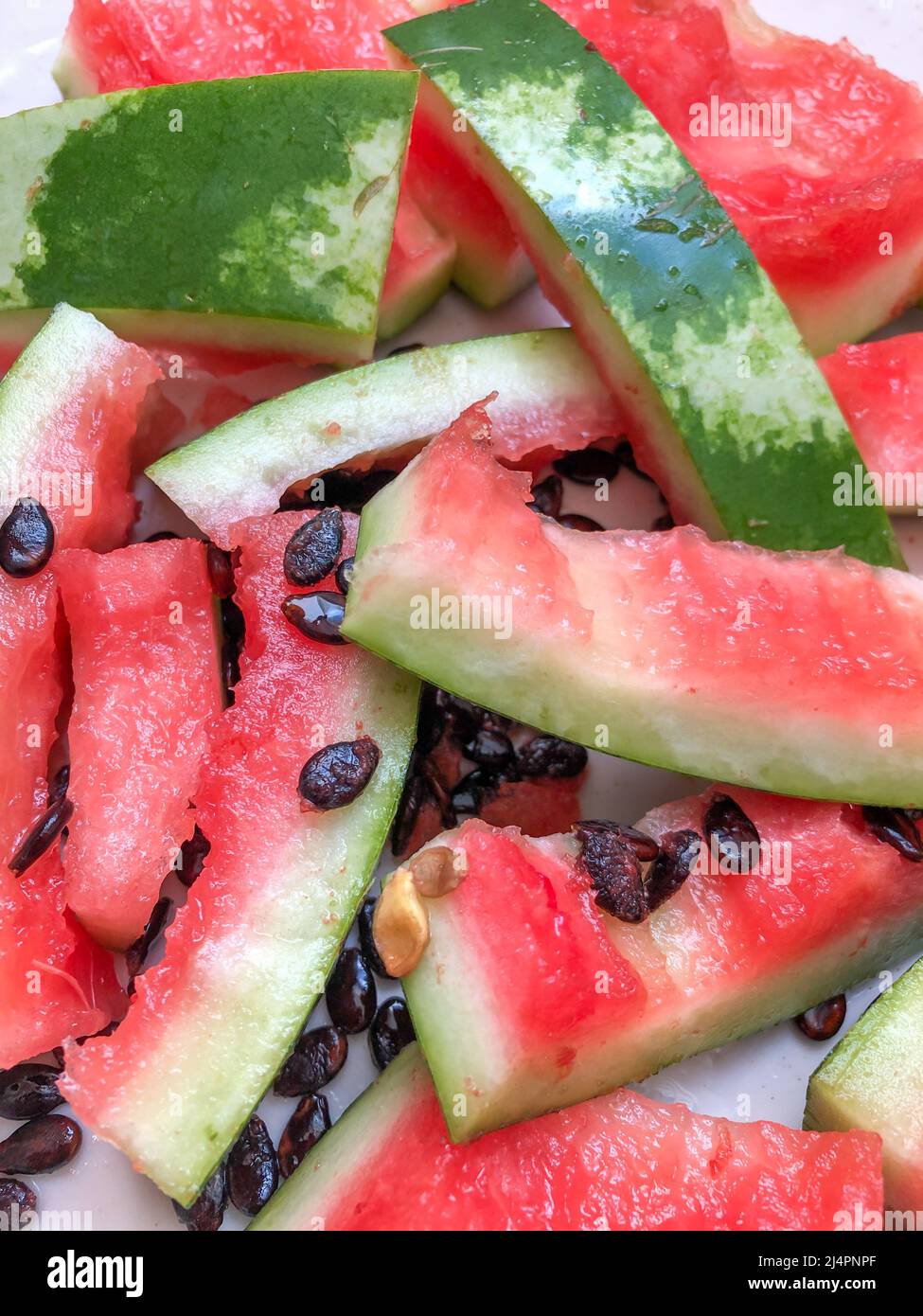 watermelon rinds, closeup top view rind and seed leftovers from cut or ...