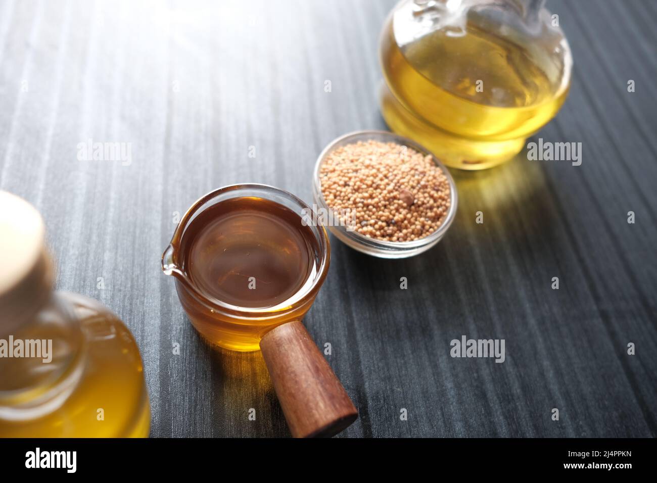 sunflower coking oil and seeds in a container on table Stock Photo - Alamy