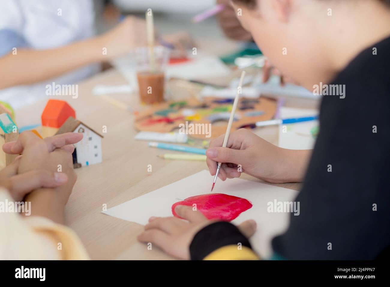 Closeup group of student sitting and studying and learning drawing with ...