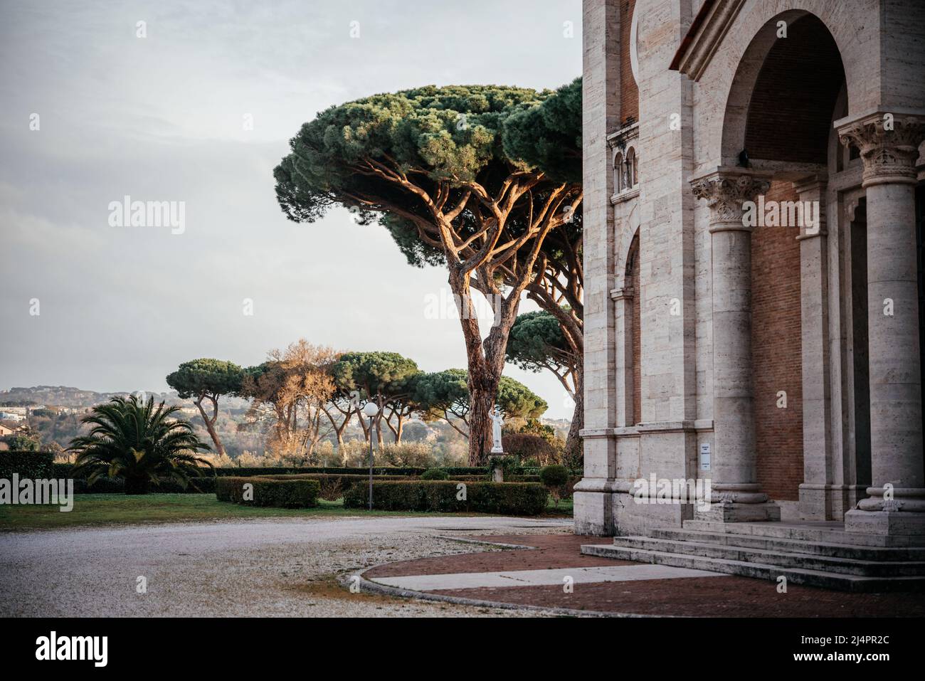 Italian Catholic church with stone pine trees at the bacgkround Stock ...