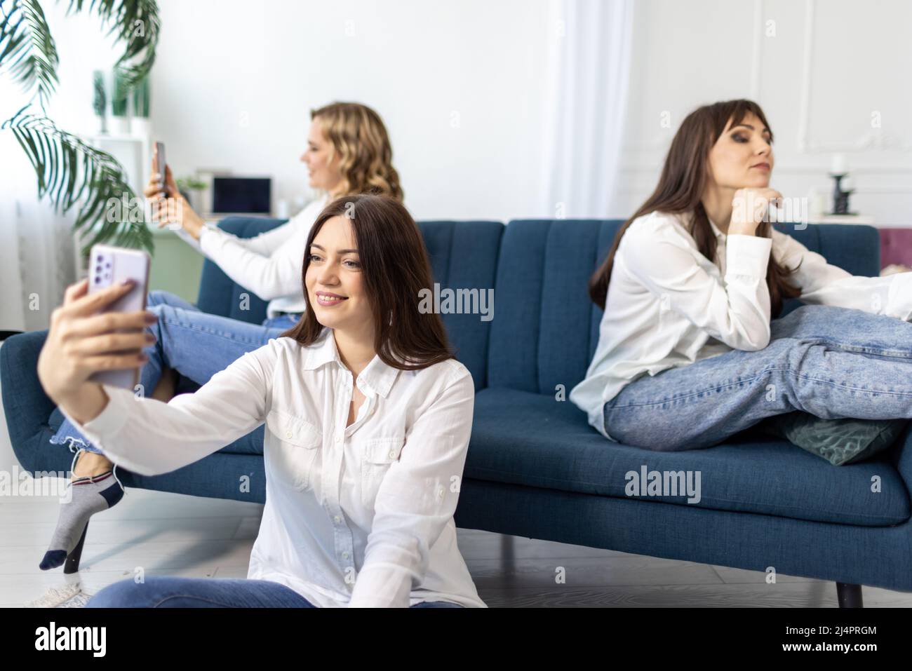 Three dependent adult enthusiastic girls - friends in stylish neat ...