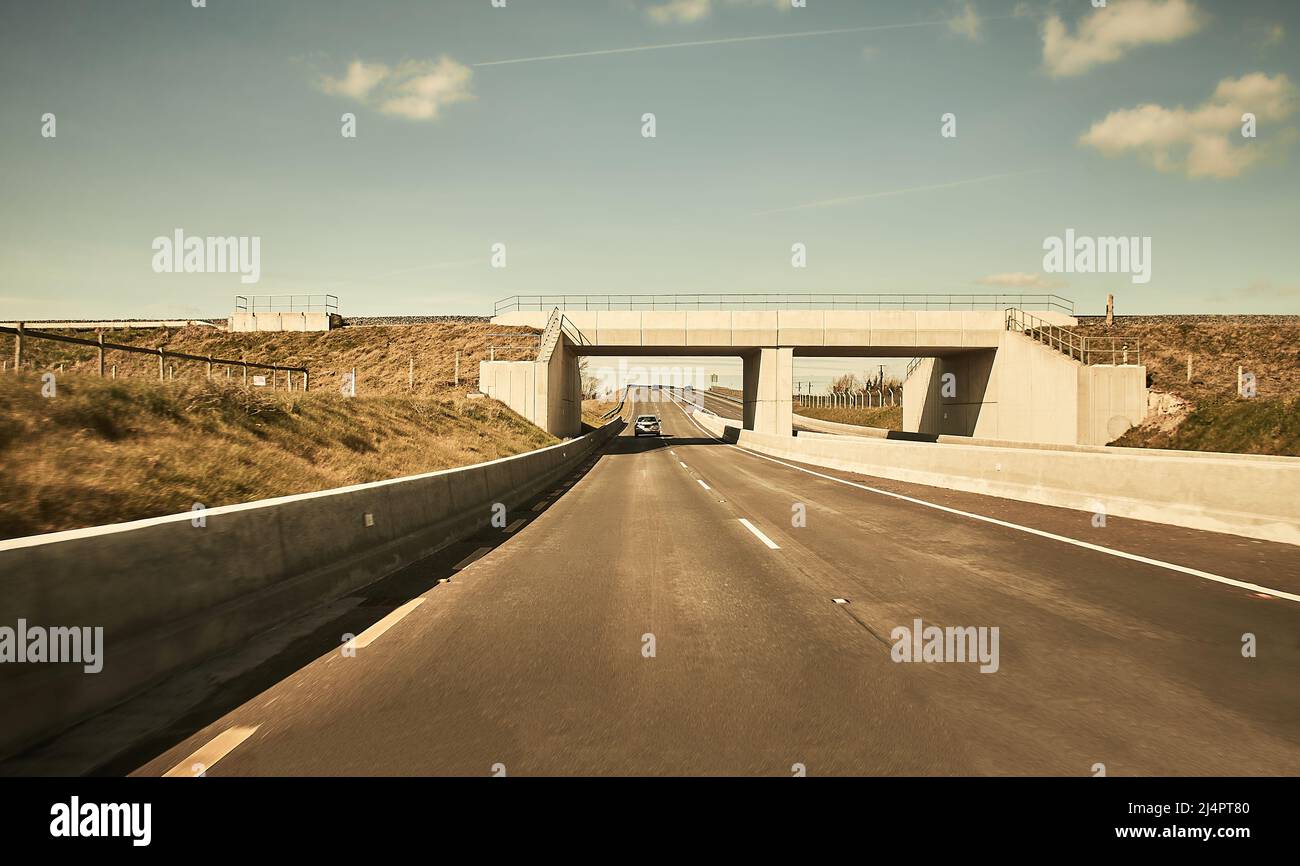 Rear view of cars driving on motorway, Ireland. Road with metal safety ...