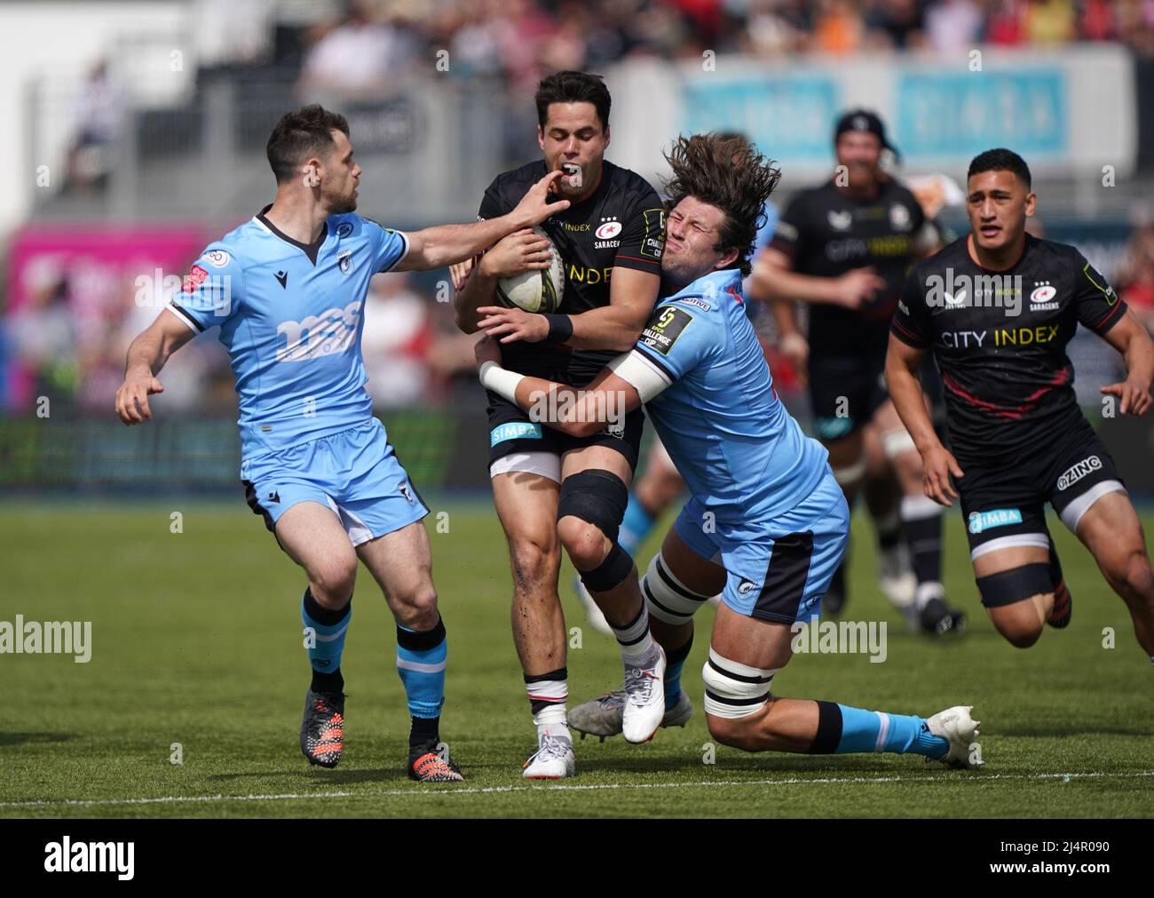 Saracens' Sean Maitland tackled by Cardiff Rugby's Tomos Williams (left ...