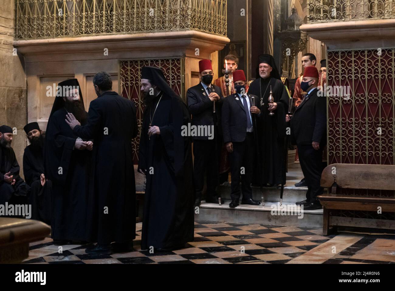 Priests and members of the Greek Orthodox church inside the Church of ...