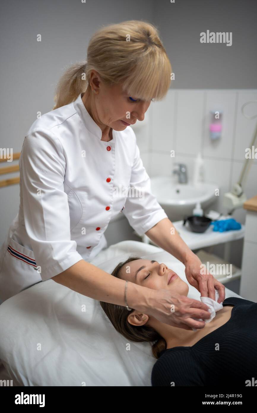 Doctor side on face hi-res stock photography and images - Alamy