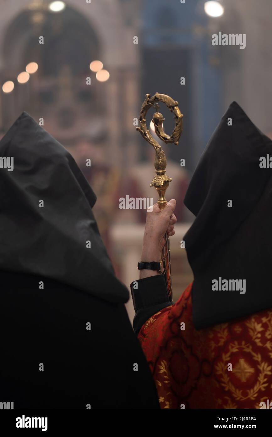 A member of the Armenian Apostolic church in his black hooded cope ...