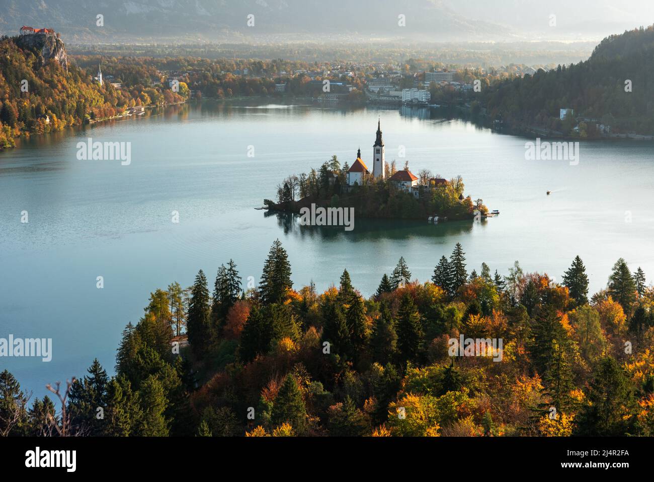 Magical autumn landscape with an island on Lake Bled. Julian Alps ...