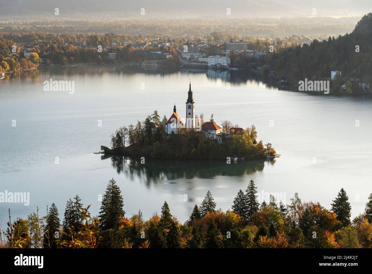 Magical autumn landscape with an island on Lake Bled. Julian Alps ...