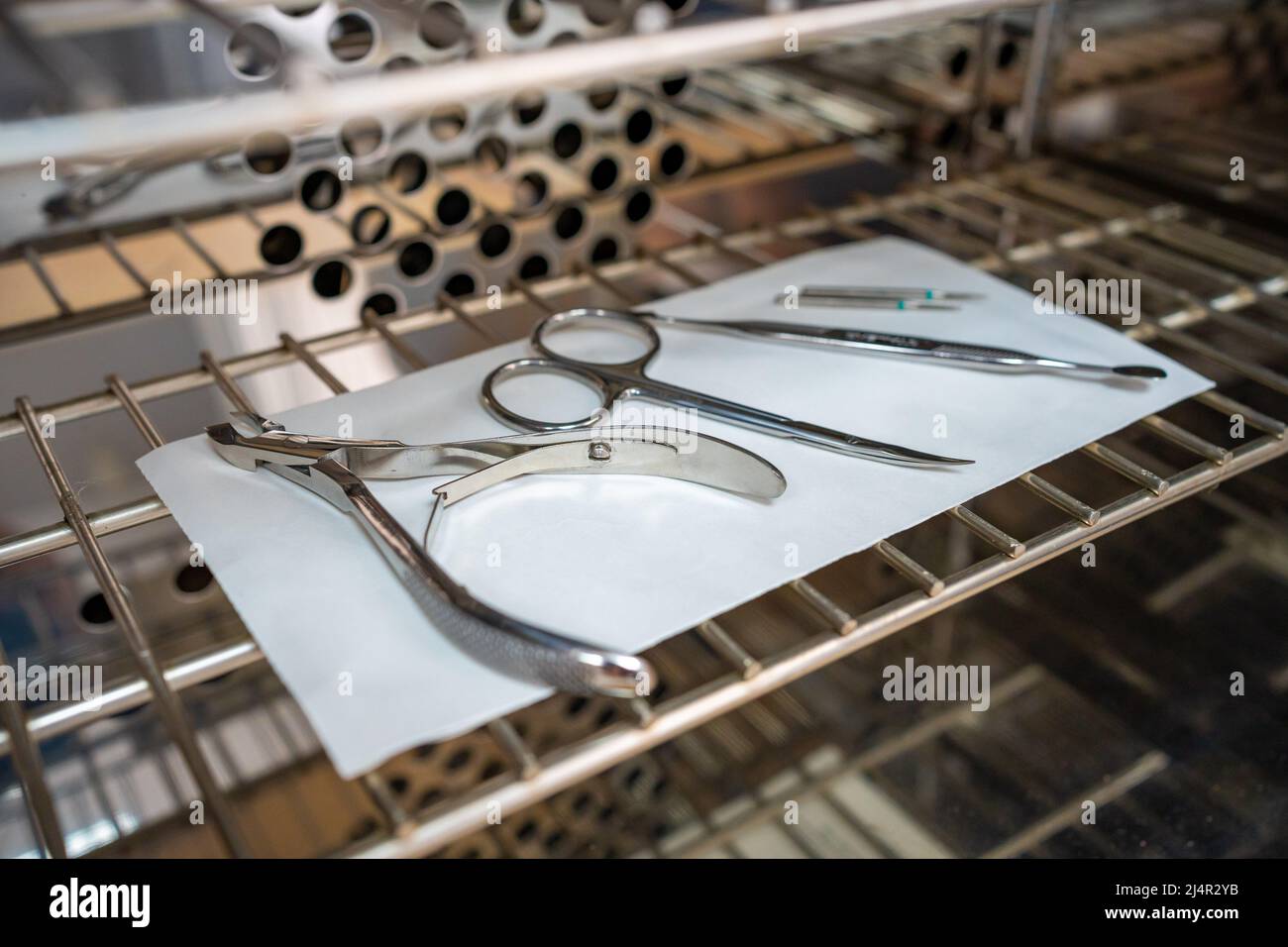 Professional disinfection of manicure tools in autoclave. Packages with ...