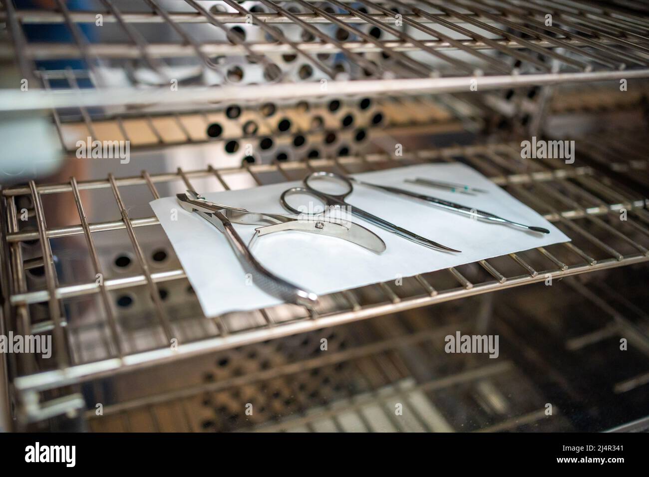 Professional disinfection of manicure tools in autoclave. Packages with ...