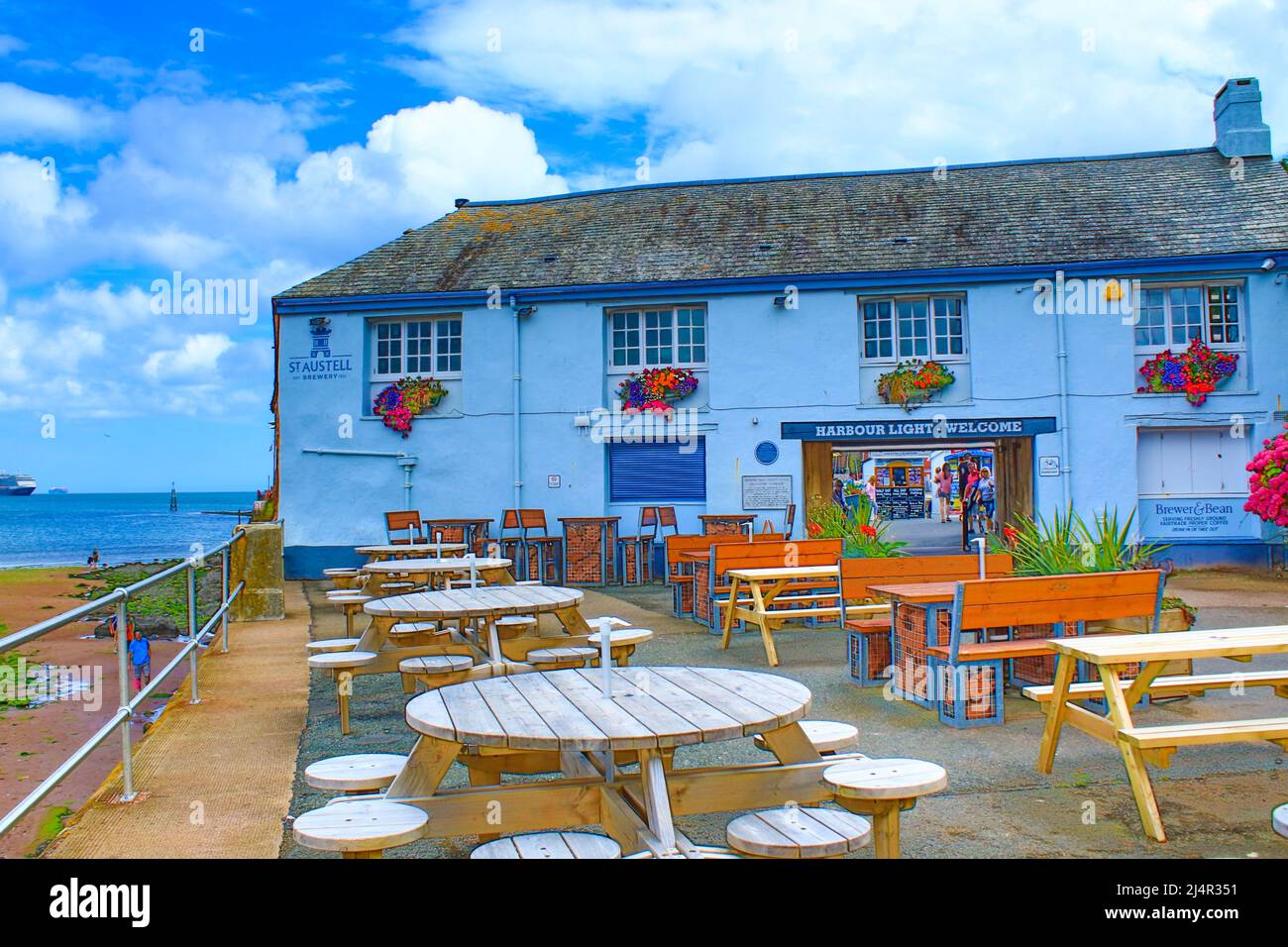 View of Paignton Harbour with boat moorings and restaurants,Devon ...