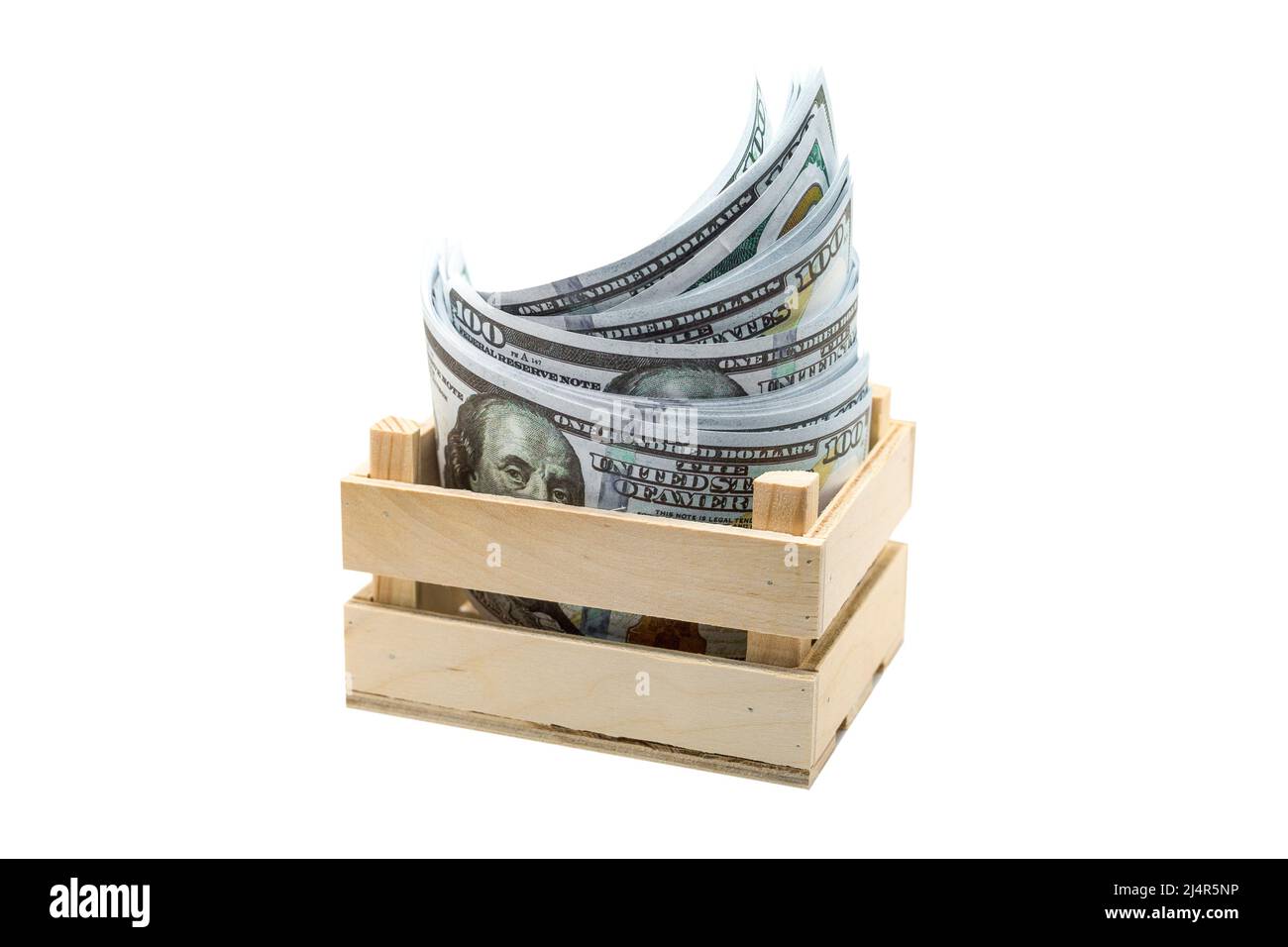 Paper money lies a small wooden box isolated, white background Stock ...