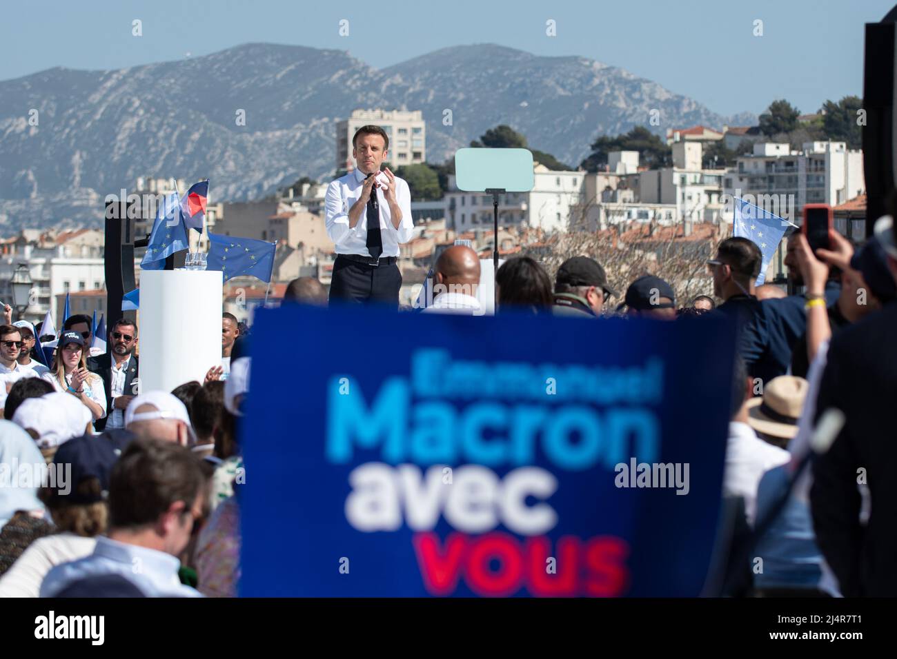 Emmanuel Macron is seen on stage giving his speech with supporters ...