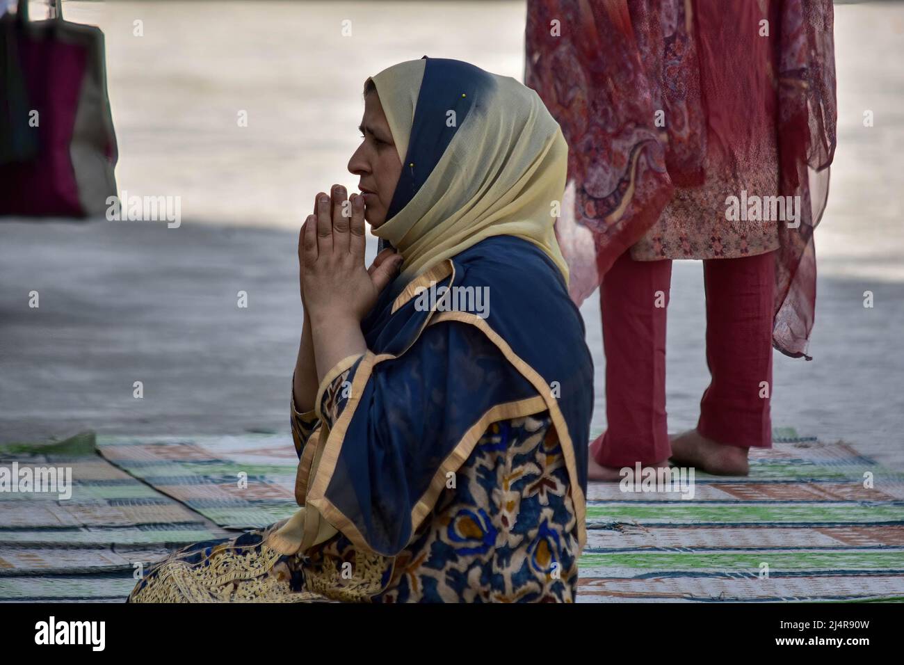 A Kashmiri Muslim woman prays at the Hazratbal Shrine during the ...
